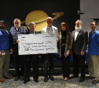 Kentucky Power delivers AEP Foundation grant to Challenger Learning Center